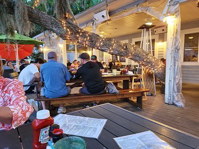 Dining under ancient oaks strung with twinkling lights – Mother Nature's way of saying "this meal deserves a special setting."