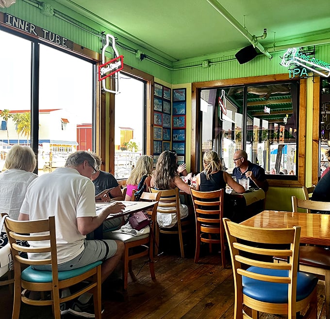 Where strangers become friends over menus. The windows frame the water view like living paintings that complement your meal.