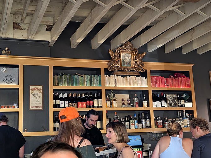 The bar shelves are stocked like a well-read library, except these books are liquid and the stories get better with each sip.