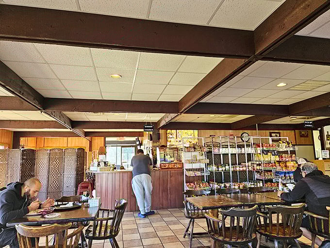Where locals gather for a taste of home and visitors become regulars. The wooden beams above match the sturdy tables below—both built for serious eating.