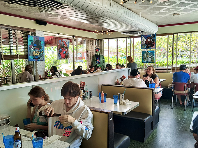 The dining room hums with the energy of a community gathering place—where locals and visitors alike find common ground over uncommonly good food.