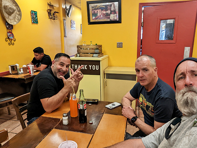 Happy diners sharing laughs and tacos - the universal language of good food transcending all cultural barriers.