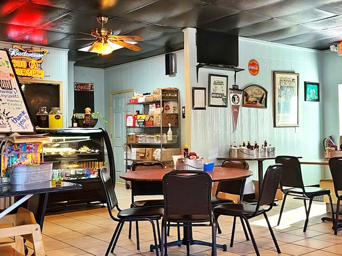 Vintage Coca-Cola signs and ceiling fans create that perfect diner atmosphere—where calories don't count and coffee refills are practically mandatory.