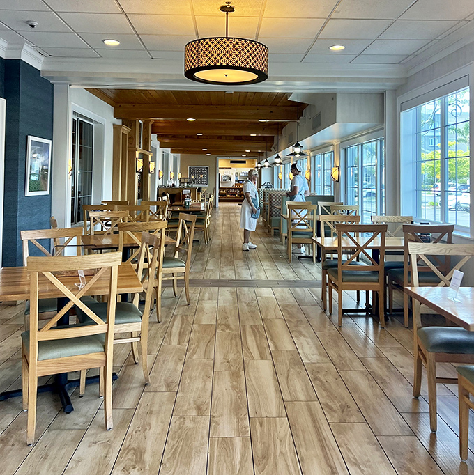 Light streams through windows illuminating wooden chairs that have hosted countless conversations, celebrations, and first-date butterflies over comfort food.