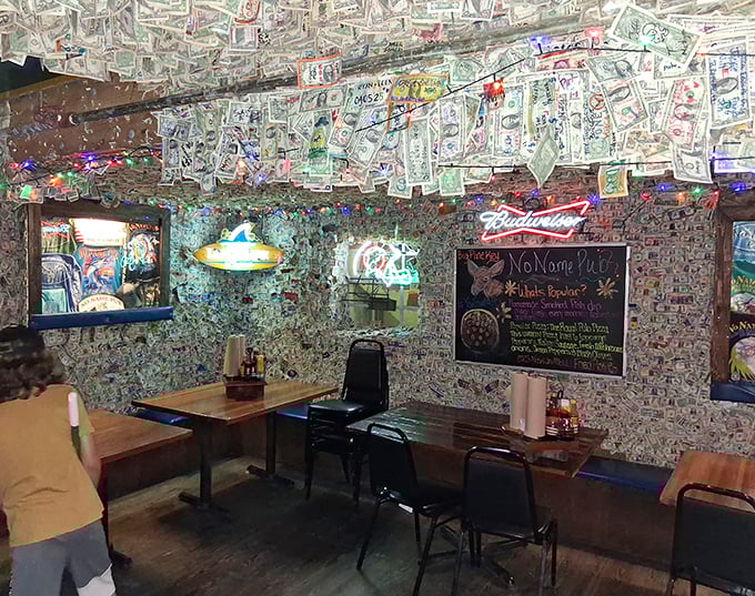 Every inch tells a story – neon signs glow against the backdrop of thousands of personalized dollar bills in this utterly unique dining space.