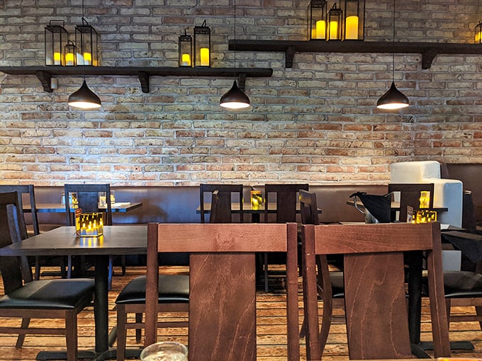 Exposed brick and glowing lanterns create the perfect mood lighting for falling in love—with your dinner or your companion.