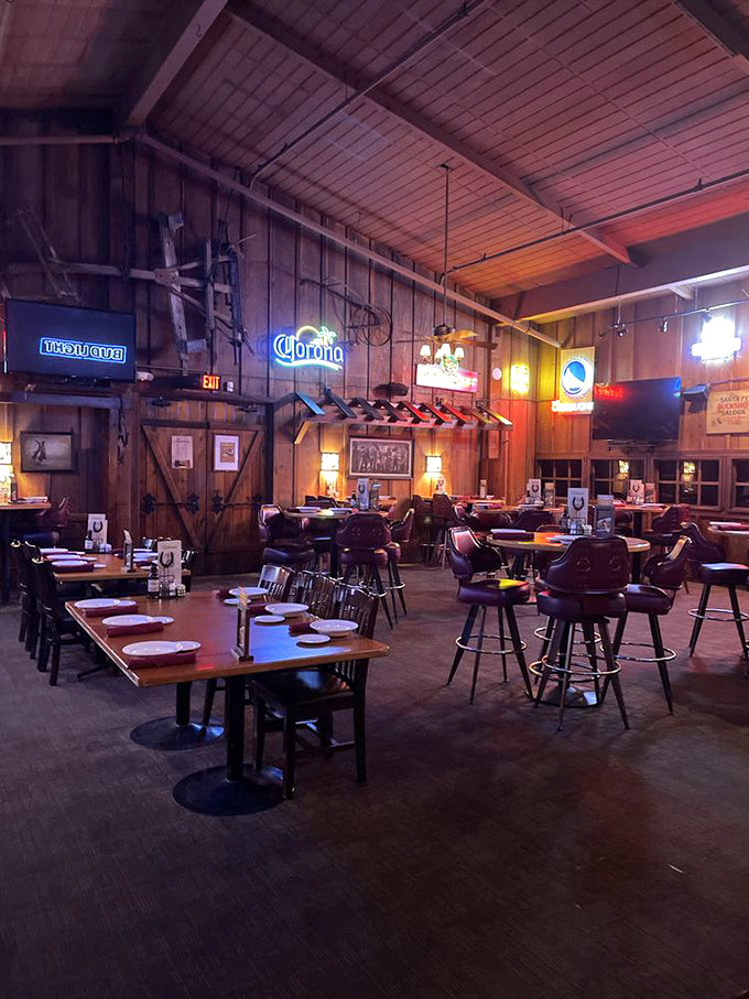 The bar area's wooden charm and neon signs create that rare atmosphere where both cowboys and accountants feel equally at home.