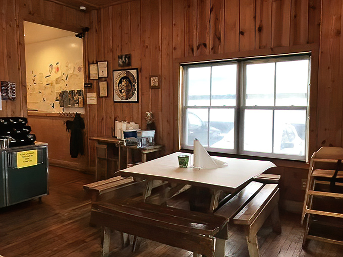 Simple wooden tables invite conversation and community—the perfect backdrop for the serious business of enjoying exceptional barbecue.