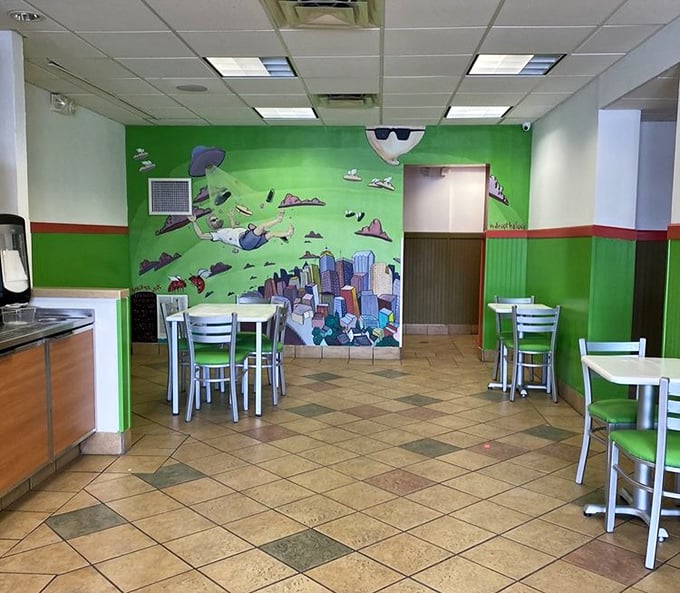 The dining area's vibrant green walls and playful mural create an energetic vibe that matches the bold flavors found between Mickey's bread.