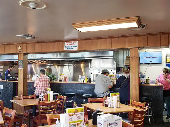 The counter seating offers front-row tickets to the culinary show—comfort food theater at its finest.