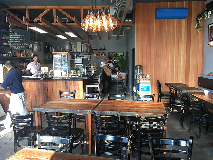 Morning light streams through windows illuminating wooden tables where breakfast magic happens daily – no wizards required, just talented cooks.