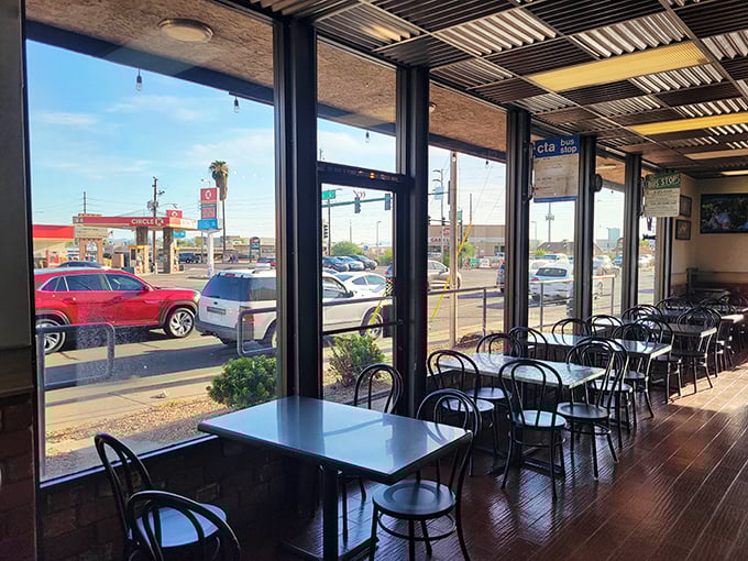Sun streams through windows into a no-frills dining area where the focus remains squarely on what matters most – the food.