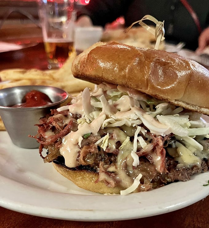 Burger artistry at its finest. This isn't fast food—it's slow food done right, with melty cheese and fresh slaw creating a symphony of textures.
