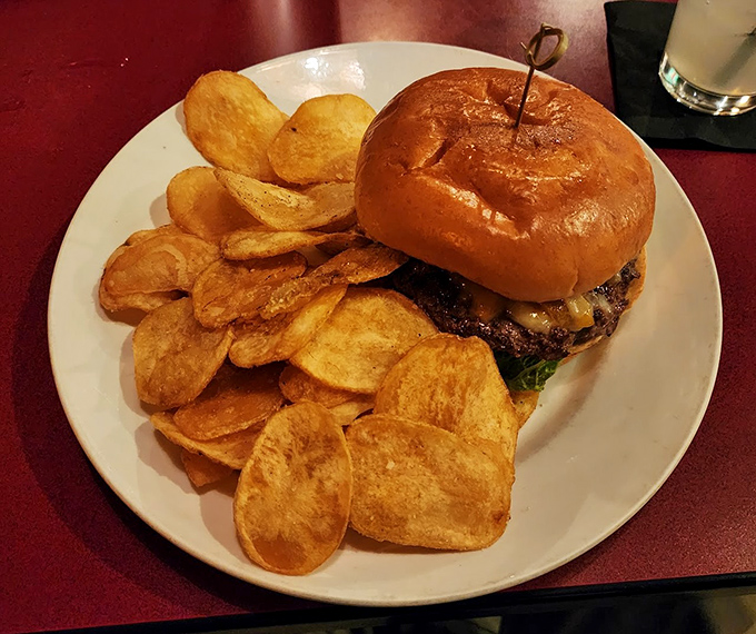 This burger isn't just dinner—it's an event, with house-made chips standing guard around a brioche bun that's practically begging to be Instagram famous.