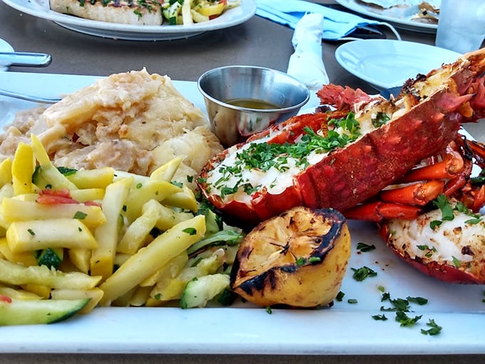 The fisherman's platter that makes you grateful for whoever first thought to put seafood on a plate. That grilled lemon isn't just garnish—it's a game-changer.
