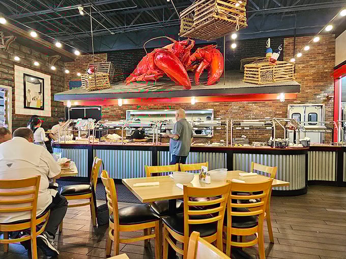The buffet line stretches beneath that watchful lobster mascot, a red sentinel guarding treasures from the deep.