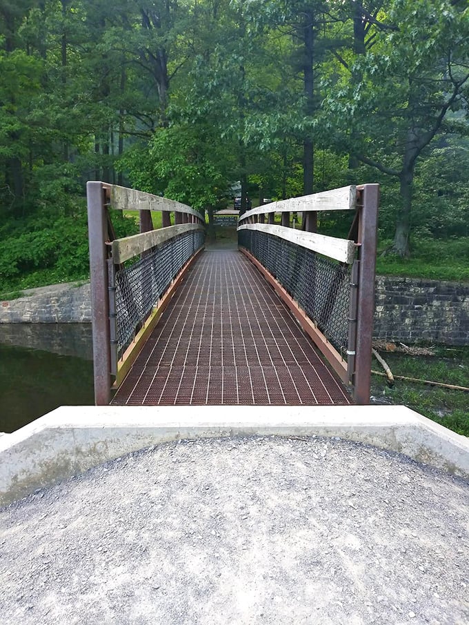 Crossing this bridge feels like entering a storybook – the kind where cell service conveniently disappears and nobody minds.