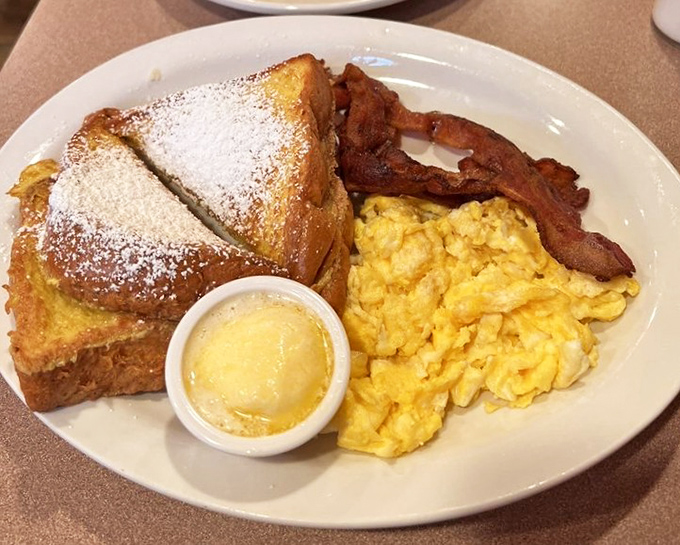 French toast that's had a spa treatment—golden, fluffy, and dusted with powdered sugar like the first perfect snowfall of winter.