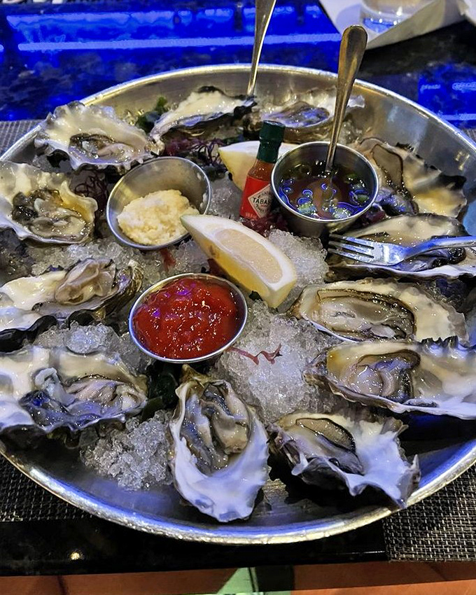 Fresh oysters on ice—nature's perfect appetizer—served with classic accompaniments and the unspoken promise that you'll order another round before the night's over.