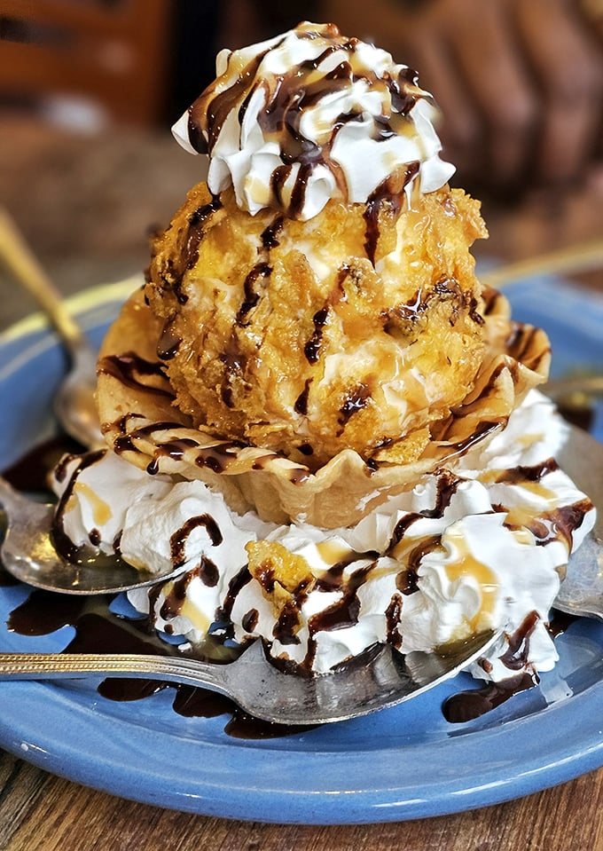 Fried ice cream that defies physics—hot, cold, crunchy, and creamy in each bite. This mountain of dessert perfection makes sharing both necessary and slightly disappointing.