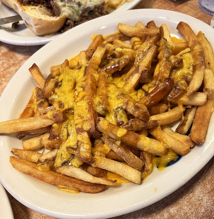 These cheese-smothered fries aren't just a side dish—they're the main event's scene-stealing sidekick. Crispy, golden, and unapologetically indulgent.