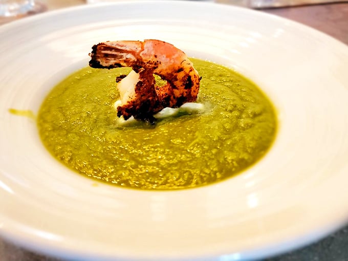 A vibrant green gazpacho crowned with a perfectly cooked shrimp. This soup doesn't just refresh – it transports you to coastal Spain.