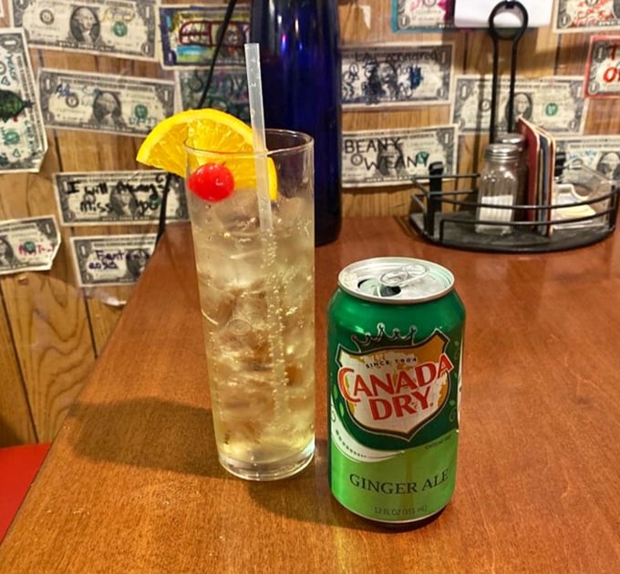 Even the drinks here feel like characters in a story—a tall ginger ale with a cherry and orange slice, ready for its close-up.