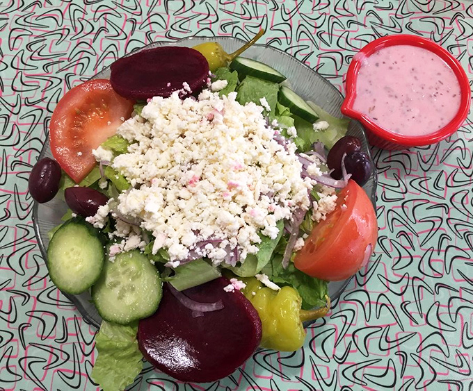 A Greek salad that brings Mediterranean sunshine to Michigan—bright, fresh, and topped with enough feta to make Zeus himself nod in approval.