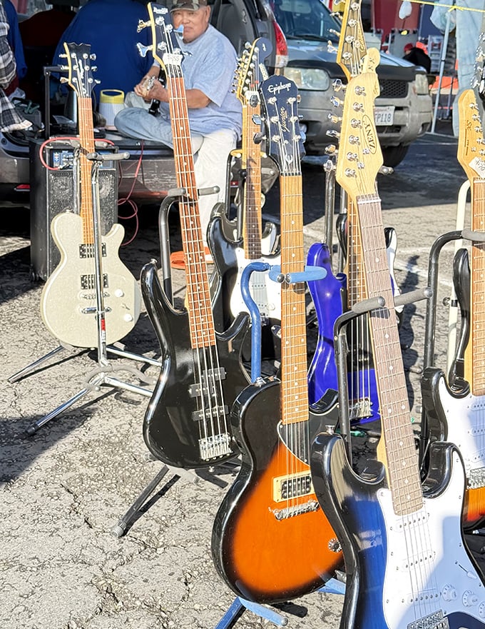 Guitar gallery that would make Eric Clapton do a double-take—each instrument waiting for its chance to star in someone's garage band dreams.