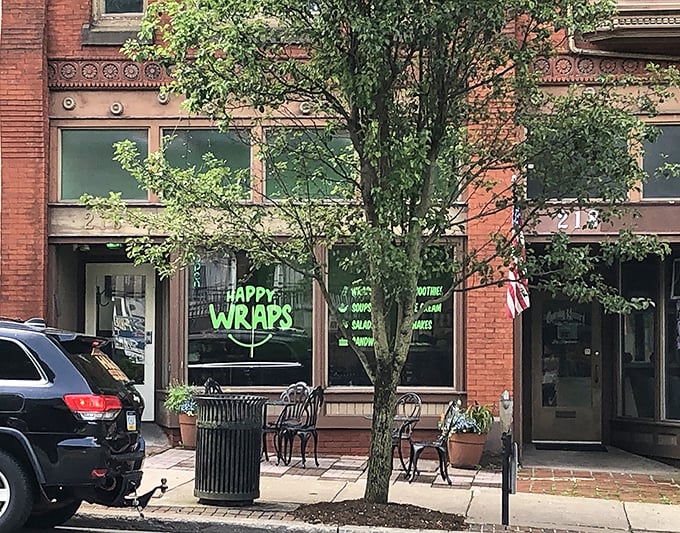 Happy Wraps' cheerful storefront proves that good food doesn't need fancy digs—just a welcoming atmosphere and a clever name.
