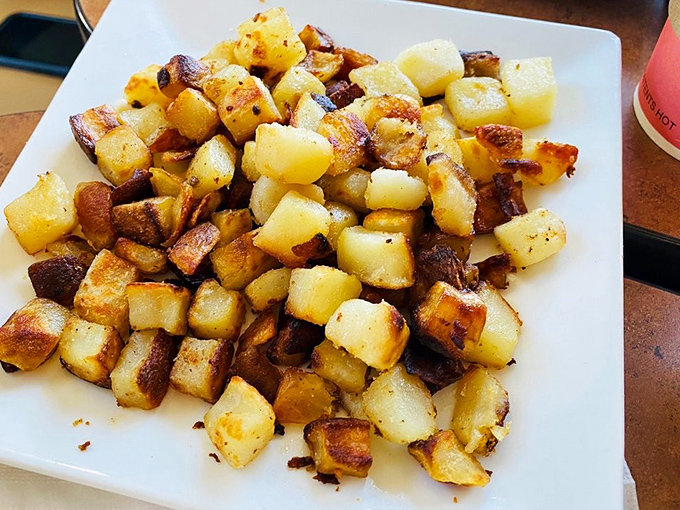 Home fries with personality—crispy edges, tender centers, and seasoned with what appears to be a PhD in potato perfection. The supporting actor that steals the show.