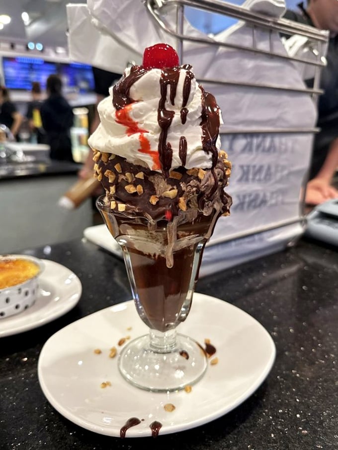This hot fudge sundae isn't just dessert—it's performance art with a cherry on top that deserves its own standing ovation.