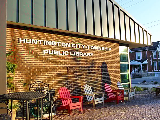 The library's welcoming facade and rainbow of Adirondack chairs invite you to bring a book outside, where reading meets vitamin D production.