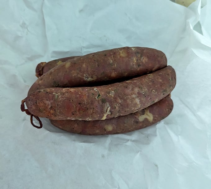 Raw kielbasa waiting for its smoky transformation—like seeing a superhero before they've put on their cape and gained their powers.