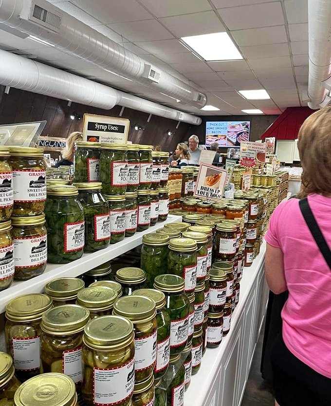 Pickle jars stacked with military precision—a glistening green army ready to deploy tangy crunch to sandwiches across Ohio.