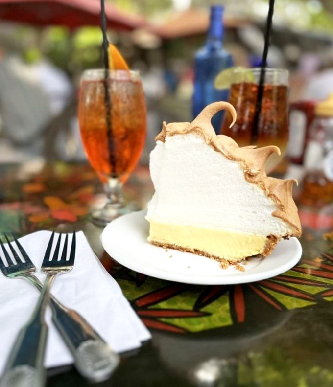 The key lime pie's towering meringue defies both gravity and restraint—a dessert that makes you wonder why you'd ever settle for a flat pie again.