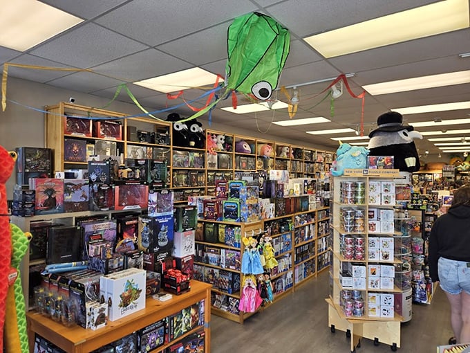A ceiling octopus watches over a wonderland of toys and games. This store understands that shopping with kids requires strategic entertainment planning.