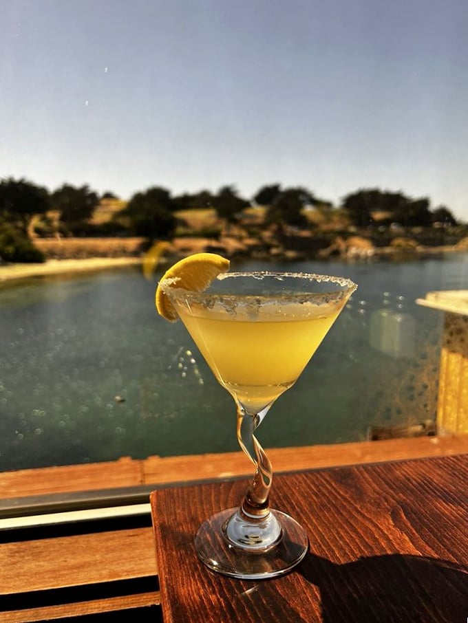 A lemon drop cocktail with the Monterey Bay as backdrop – proof that sometimes the best garnish for a perfect drink is a million-dollar view.