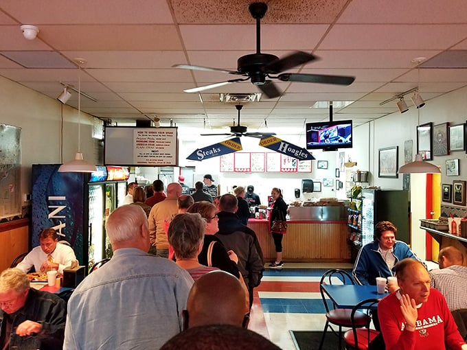 The lunch line—where strangers become comrades united by the universal language of "I can't wait to eat that."