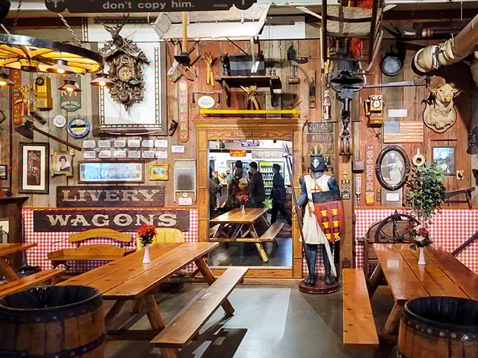 Dining among antiques at the Livery Wagons area feels like eating inside a time capsule—red-checkered nostalgia with a side of Americana.