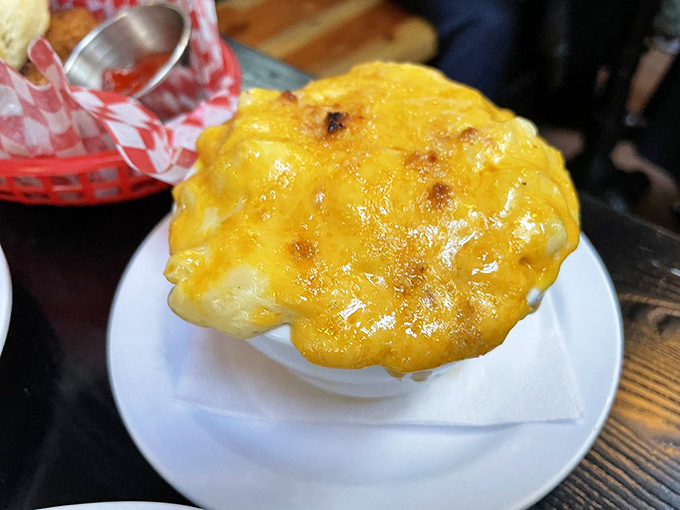 Mac and cheese that achieves that golden-brown perfection we all attempt but rarely master. This isn't just comfort food – it's a hug on a plate.