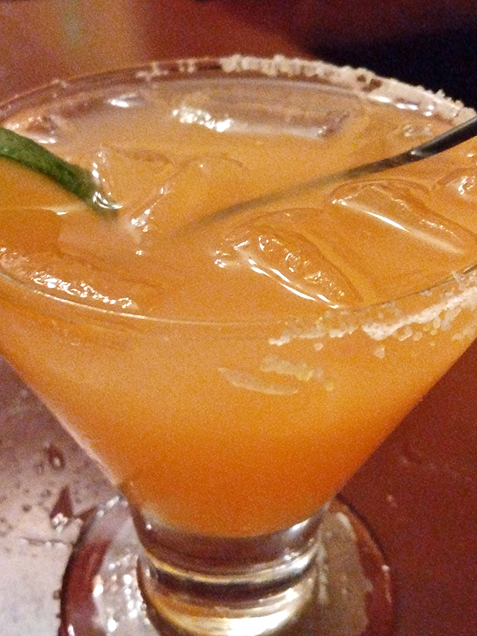 This isn't just a margarita—it's liquid sunshine in a salt-rimmed glass. The perfect companion for contemplating life's big questions, like "Should I order dessert?"