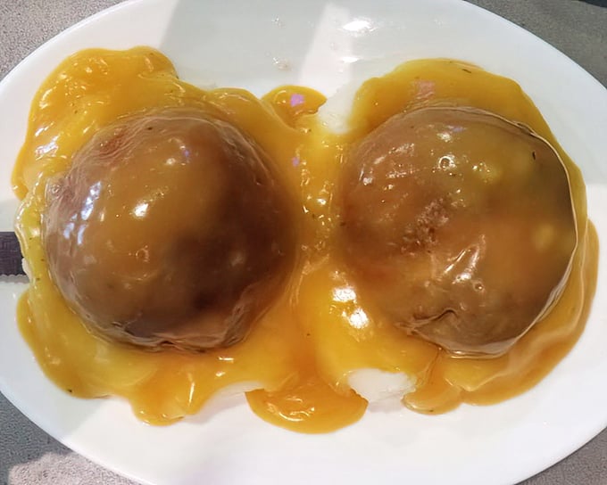 These mashed potatoes bathed in gravy look like they're auditioning for a comfort food calendar. Smooth, steamy, and ready to soothe your soul.