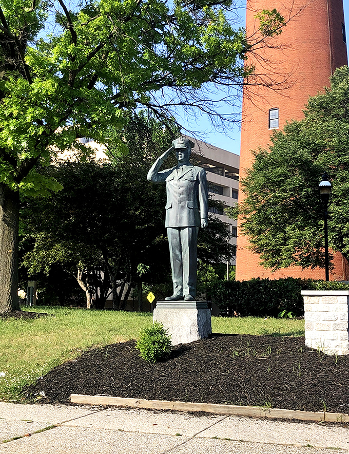 This stoic statue stands guard near the tower, a silent reminder that history is made of both buildings and the people who inhabited them.