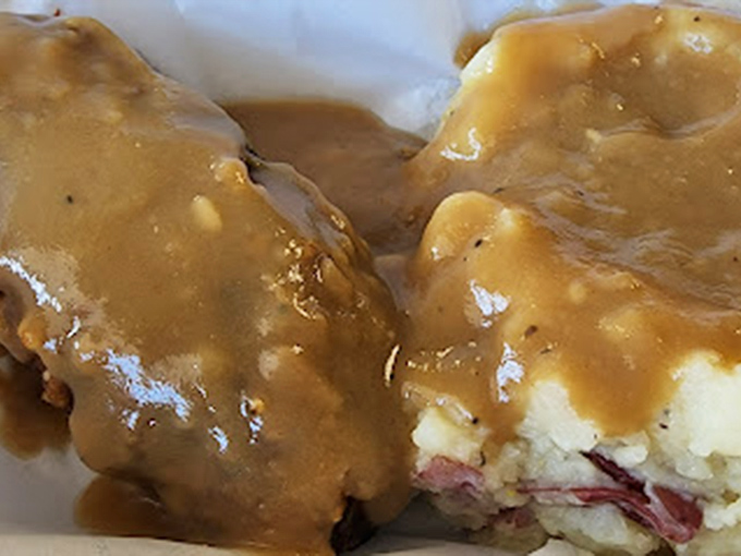 Red-skin potatoes swimming in gravy—proof that sometimes the supporting actors deserve just as much applause as the headliners.