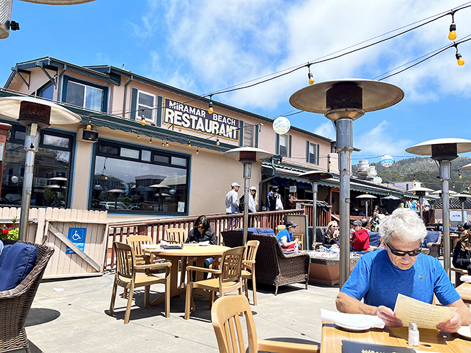 At Miramar Beach Restaurant, the ocean isn't just a view – it's practically a dining companion. Those heat lamps aren't just practical; they're sunset extenders.