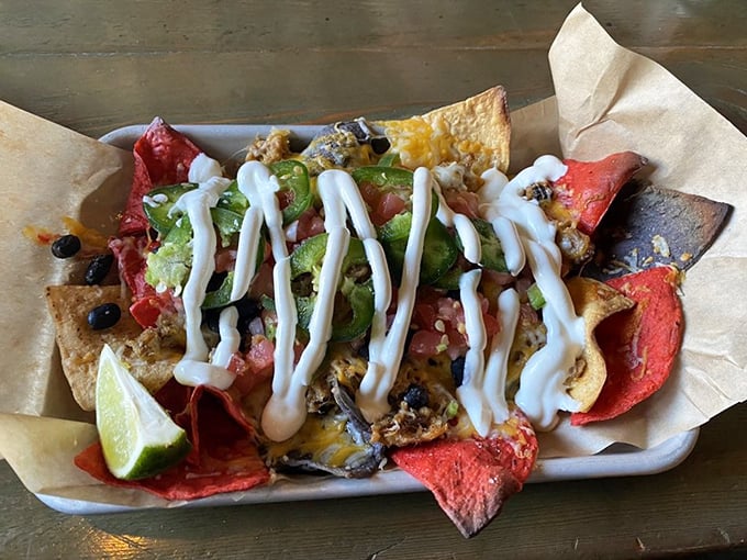 These nachos don't mess around – loaded with all the right stuff and drizzled with sauce that makes every chip worth fighting for.