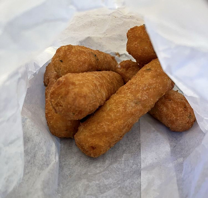 Golden-brown mozzarella sticks: the supporting actors that deserve their own spinoff show. Crispy exterior, molten cheese interior—pure comfort.