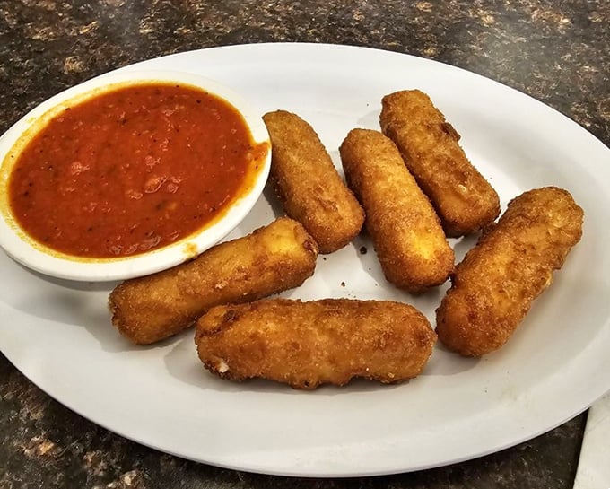 Mozzarella sticks with that perfect pull – the cheese stretches so dramatically it deserves its own soap opera. The marinara sauce is just the co-star.