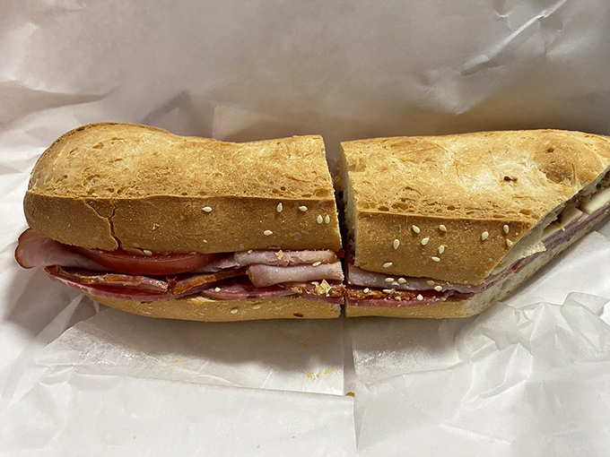 This sandwich isn't playing around—layers of meat and cheese creating the architectural marvel that lunch dreams are made of.